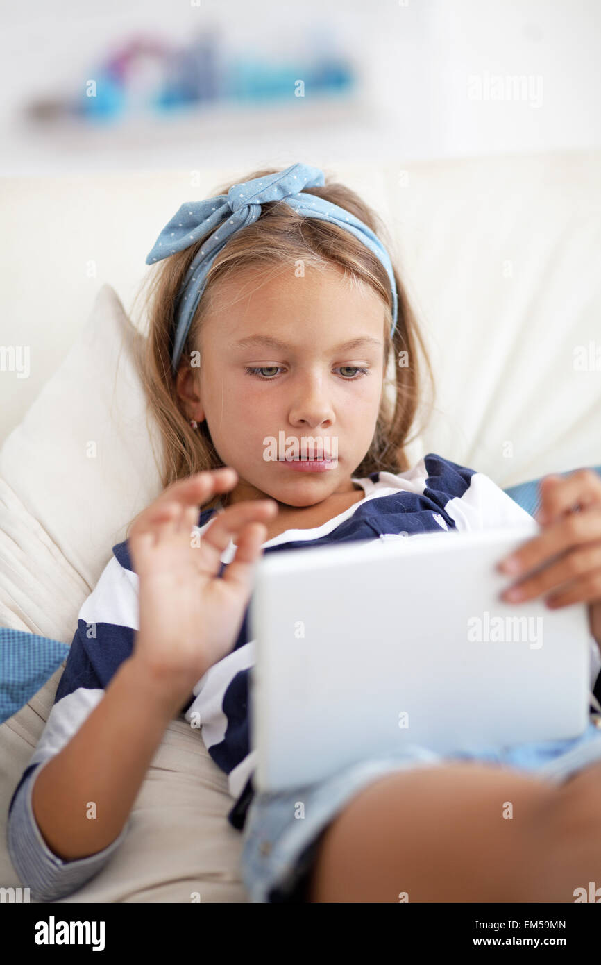 Child playing on tablet pc Stock Photo - Alamy