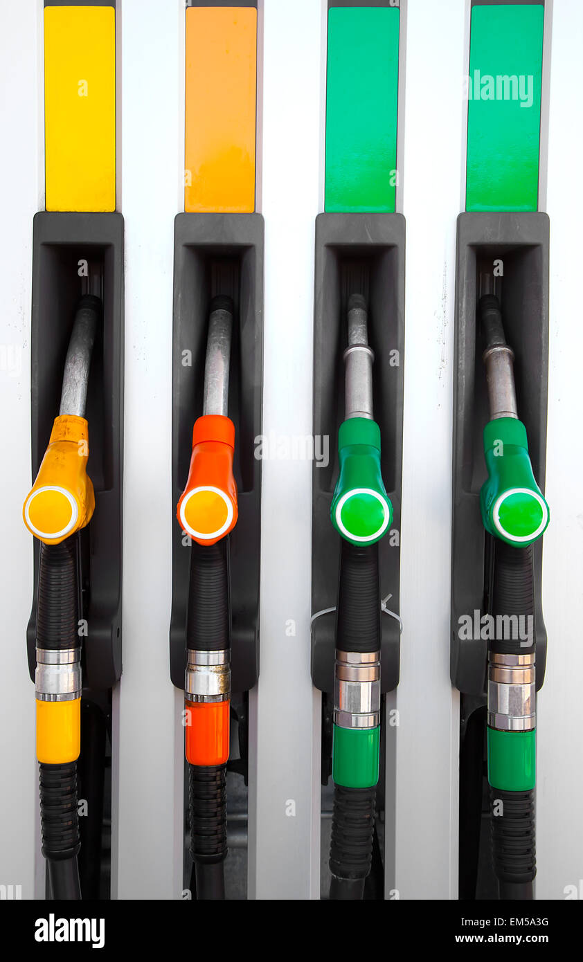 Pump nozzles at the gas station Stock Photo - Alamy