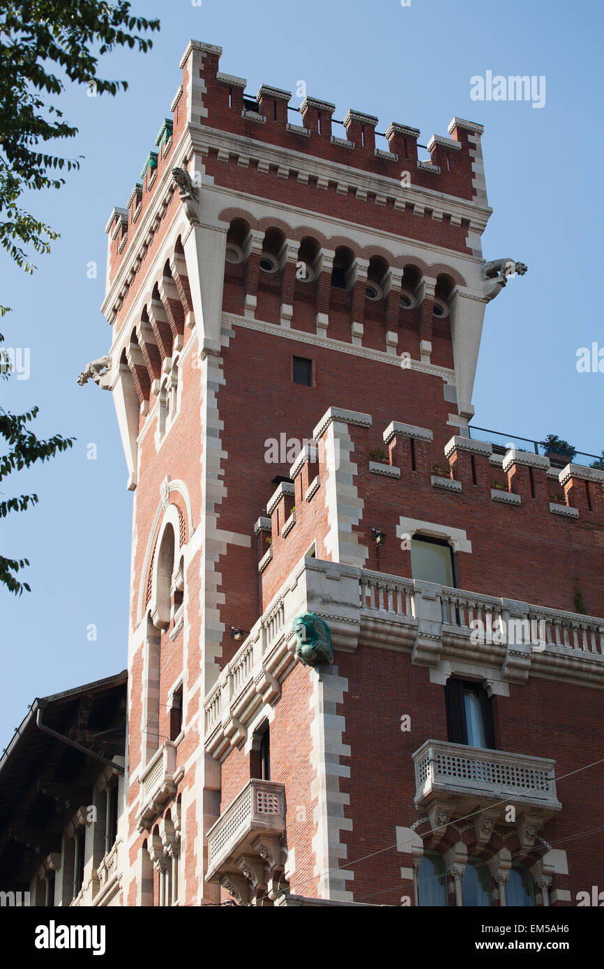 Italy, Lombardia, Milano, Brick castle tower with white stone trim ...