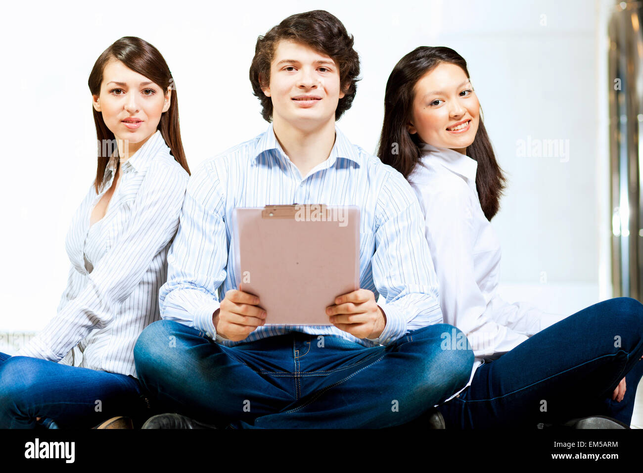 Three students smiling Stock Photo - Alamy