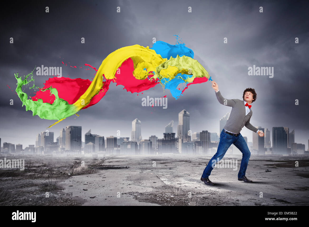 Young man and colour splash Stock Photo - Alamy