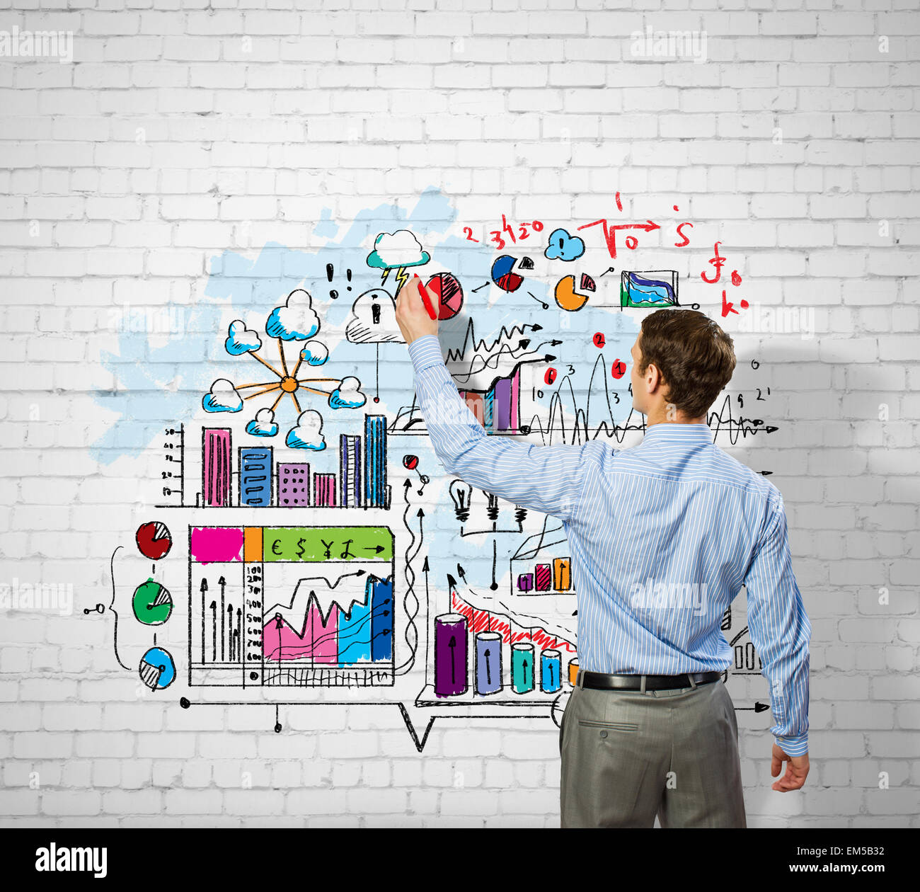 Businessman drawing sketches on wall Stock Photo - Alamy