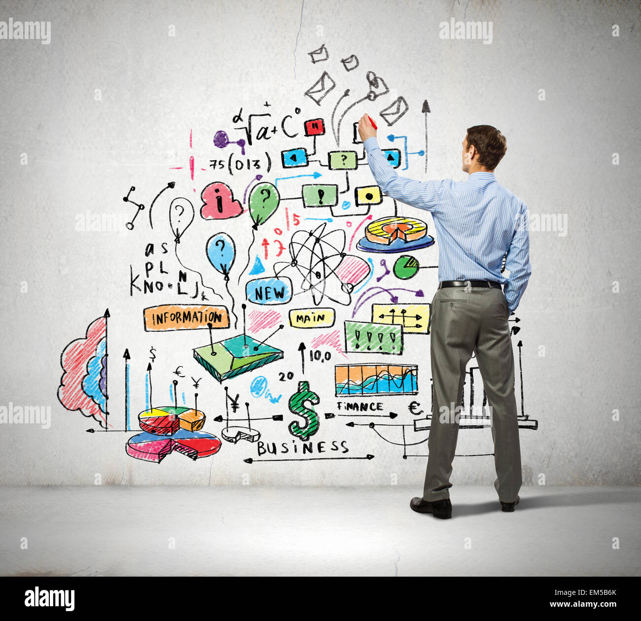 Businessman drawing sketches on wall Stock Photo - Alamy