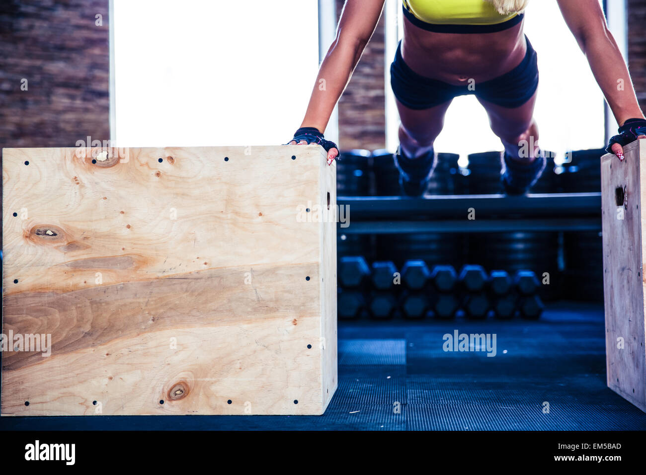Fit woman doing push ups on fit box at gym Stock Photo - Alamy