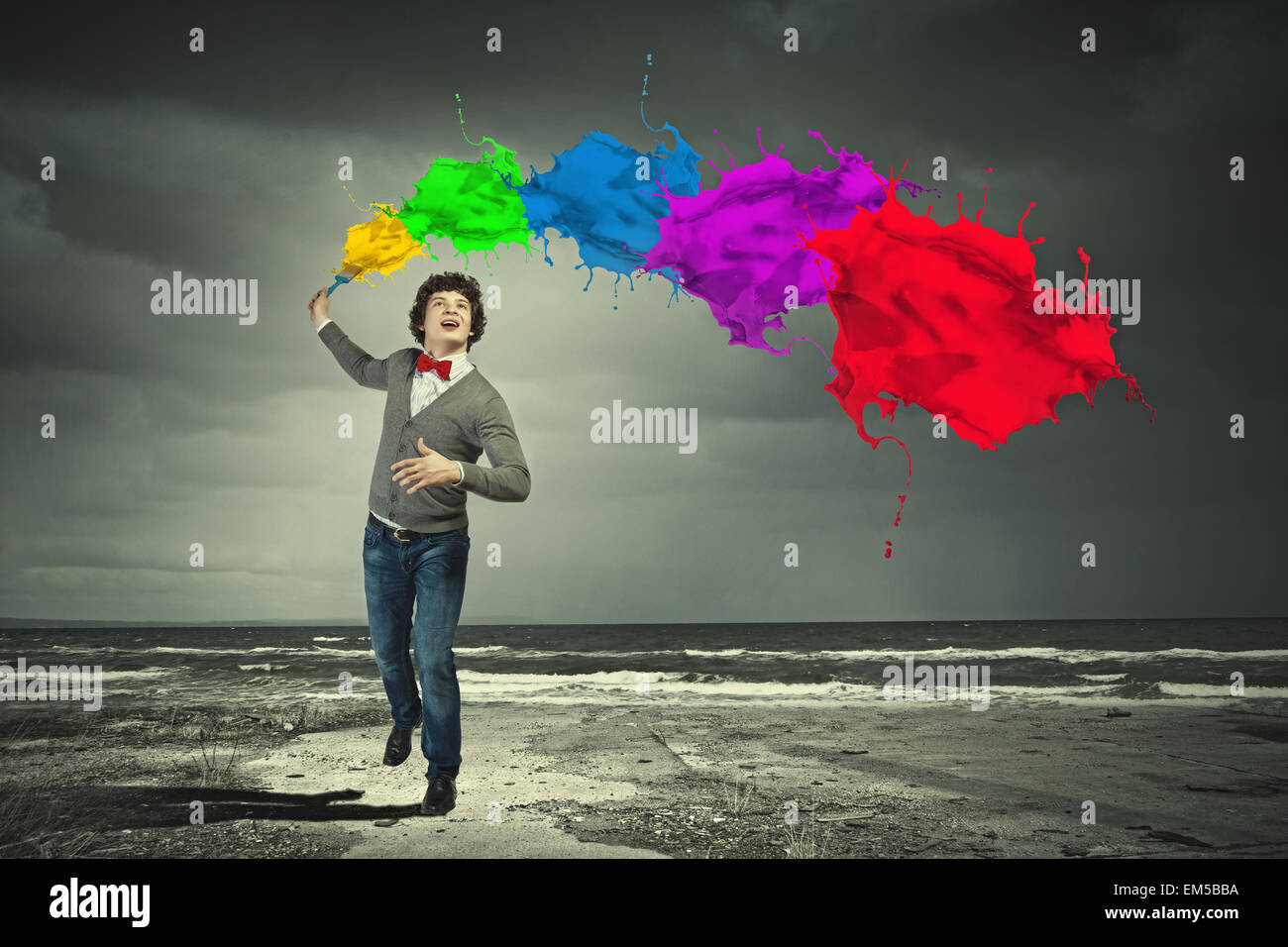 Young man and colour splash Stock Photo - Alamy