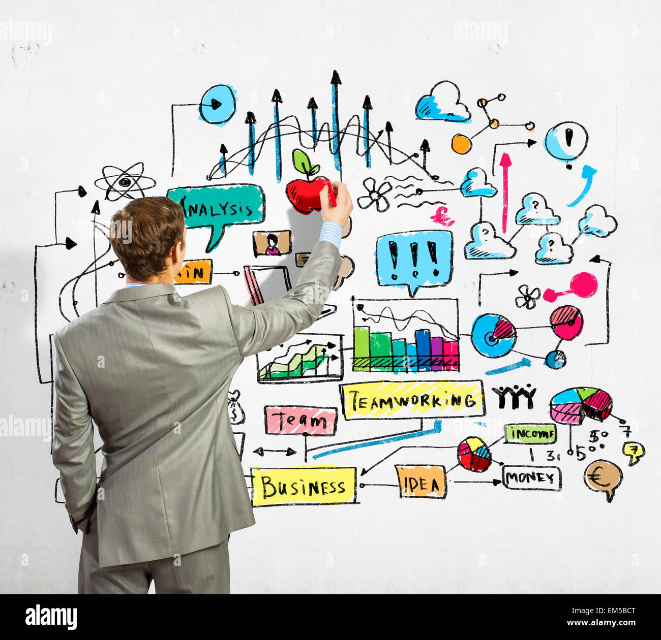 Businessman drawing sketches on wall Stock Photo - Alamy