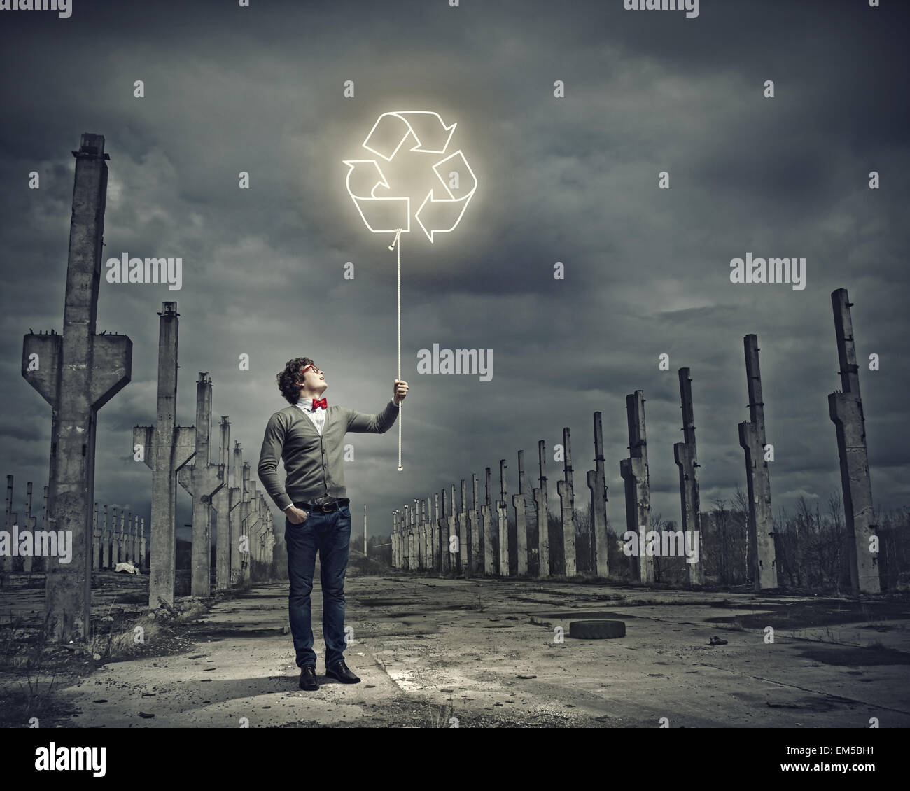 Young man with a recycle symbol Stock Photo - Alamy