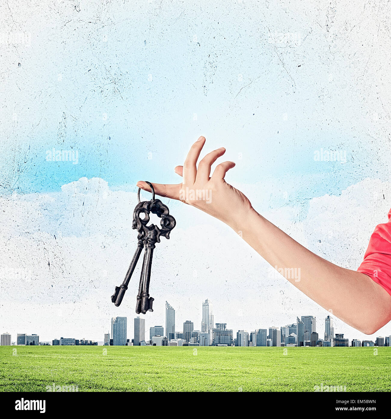 Hand holding keys Stock Photo - Alamy