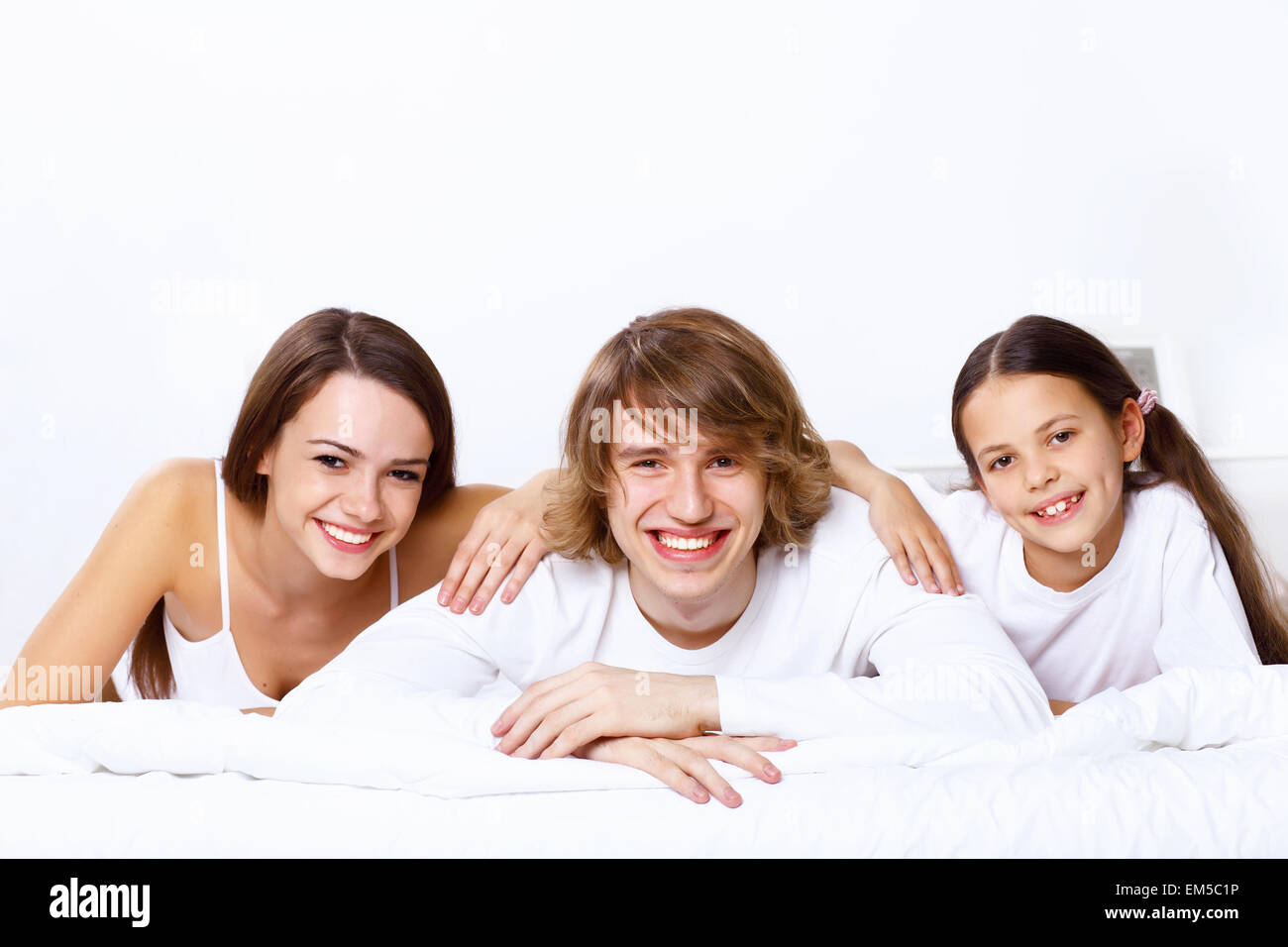 Family at home Stock Photo - Alamy