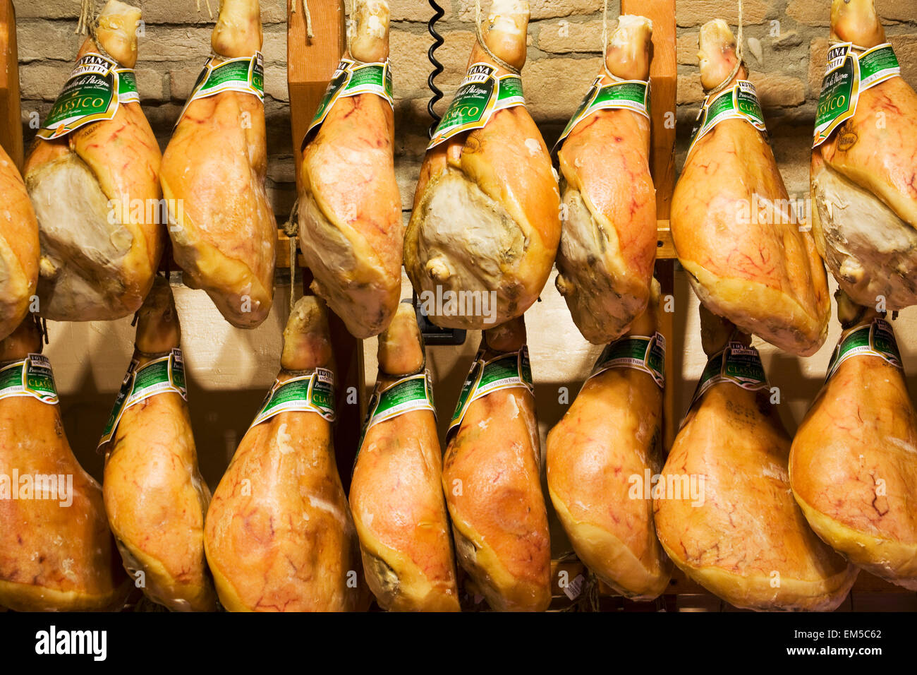 Parma hams hanging in store display; Parma, Emilia-Romagna, Italy Stock ...