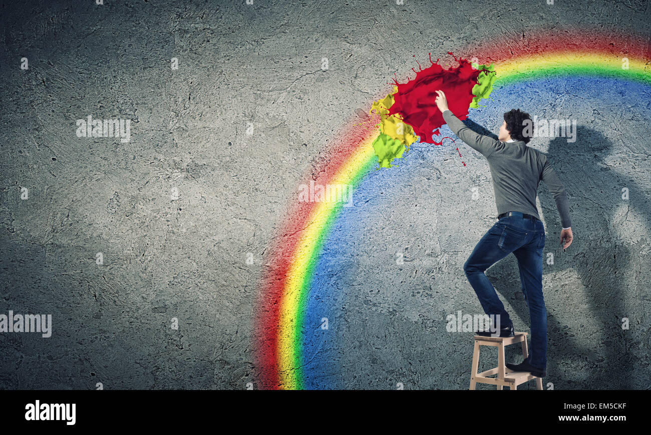 Young man and colour splash Stock Photo - Alamy