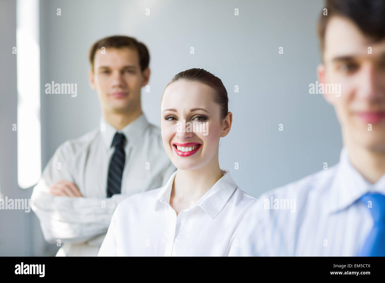 Young smiling businessman Stock Photo - Alamy