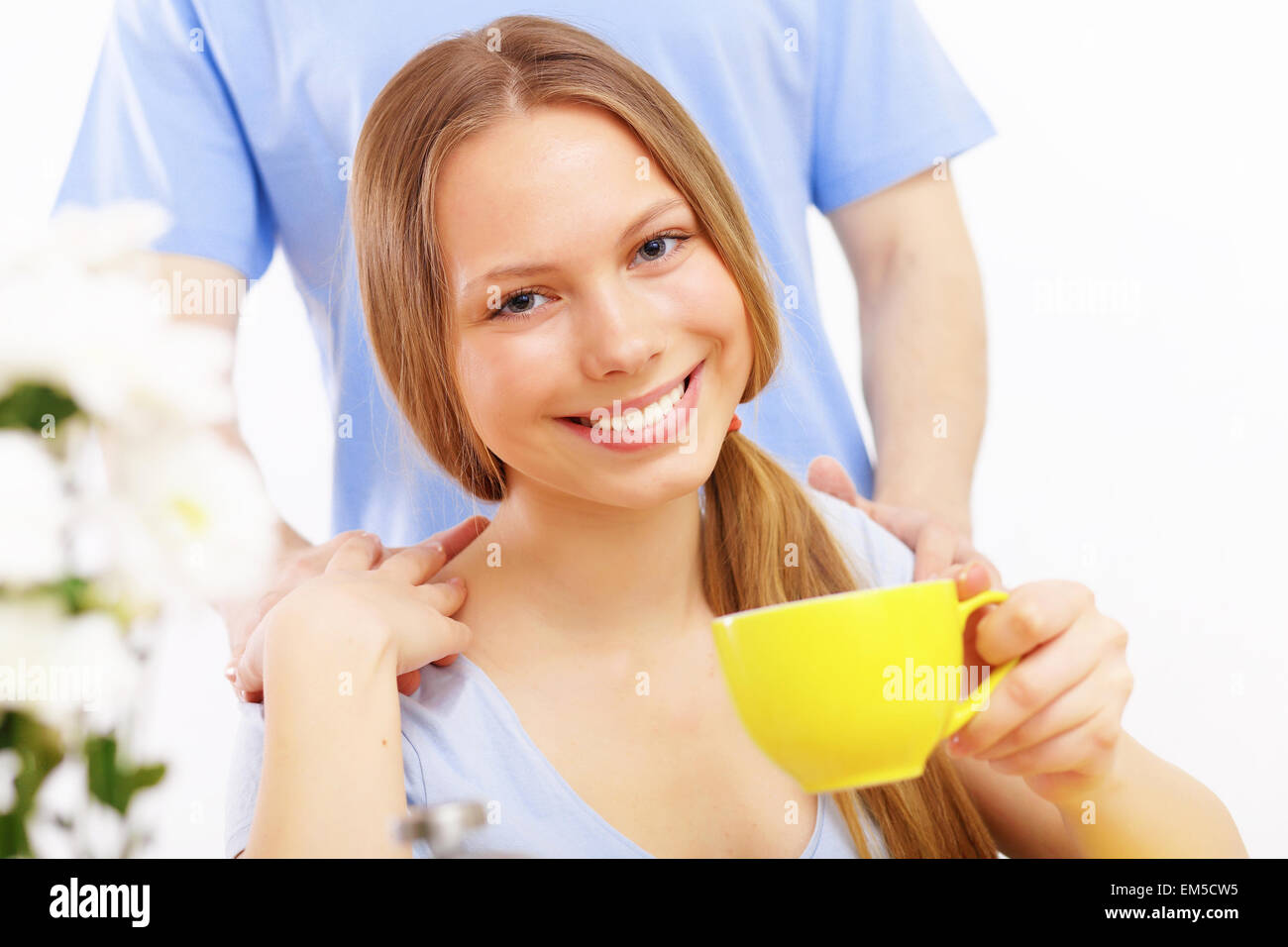 Beautiful young woman drinking tea Stock Photo - Alamy