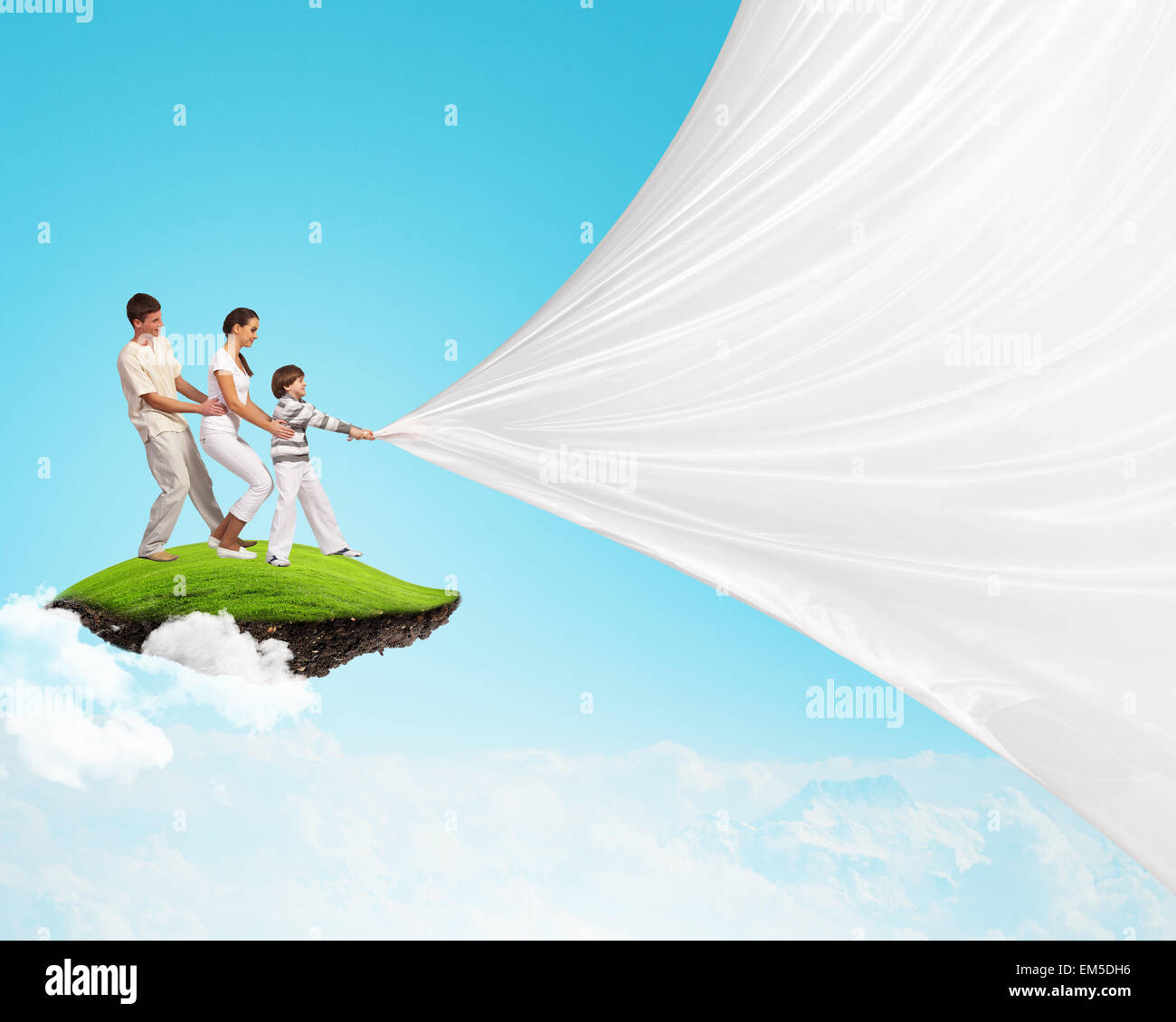 Young family pulling banner Stock Photo - Alamy