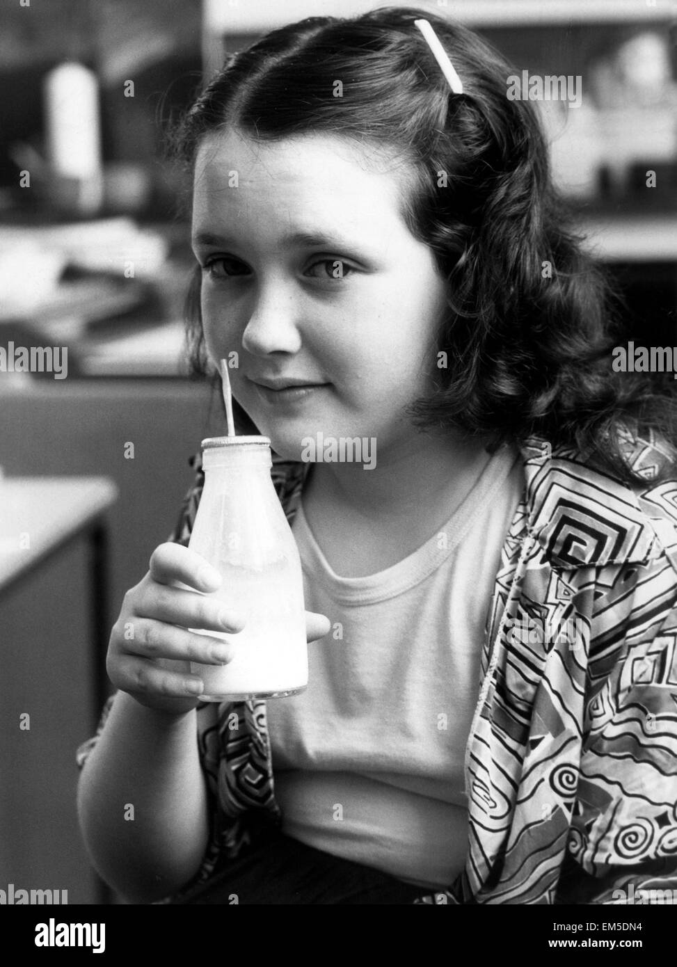 Hannah Chissick with a glass of milk. 2nd June 1987 Stock Photo - Alamy