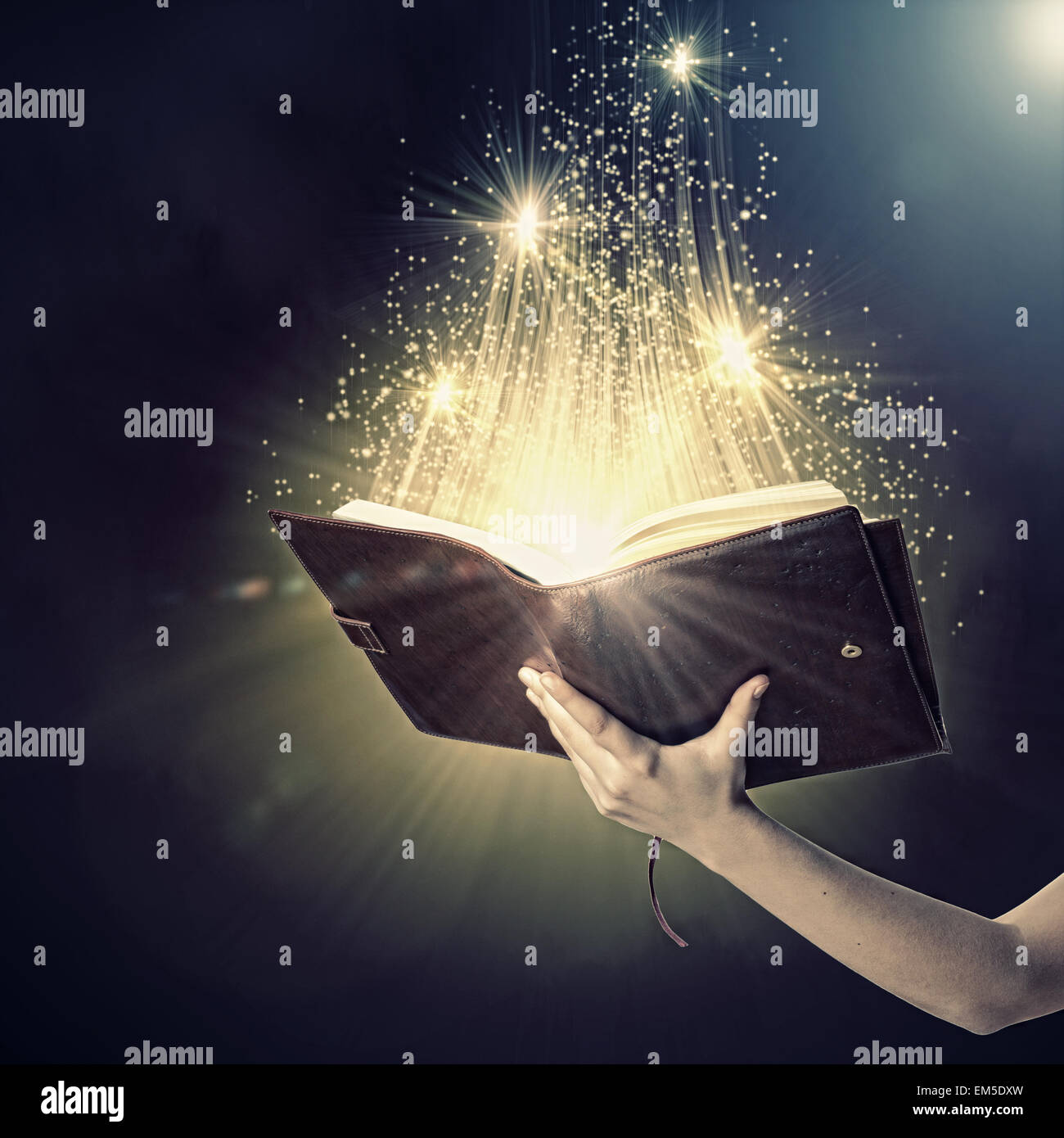 Hand with book Stock Photo - Alamy