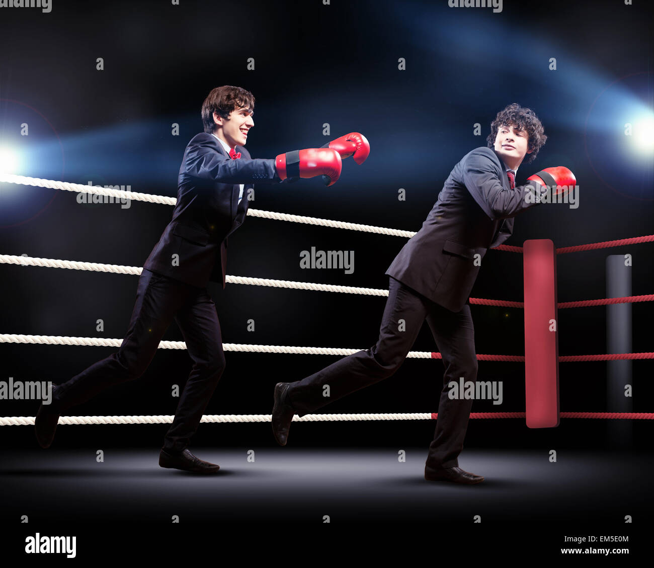 Two young businessman boxing Stock Photo - Alamy