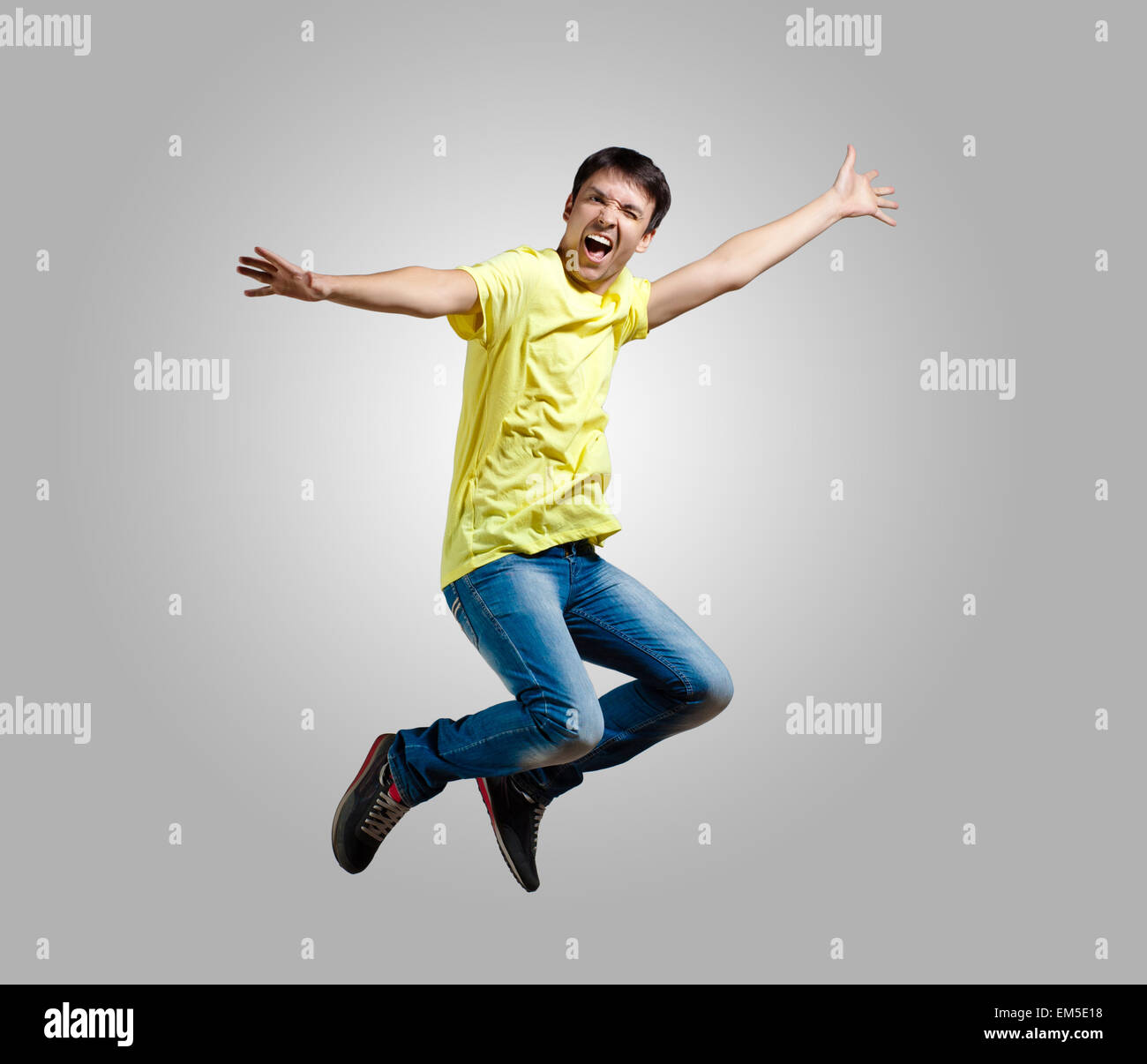 Young man dancing and jumping Stock Photo - Alamy