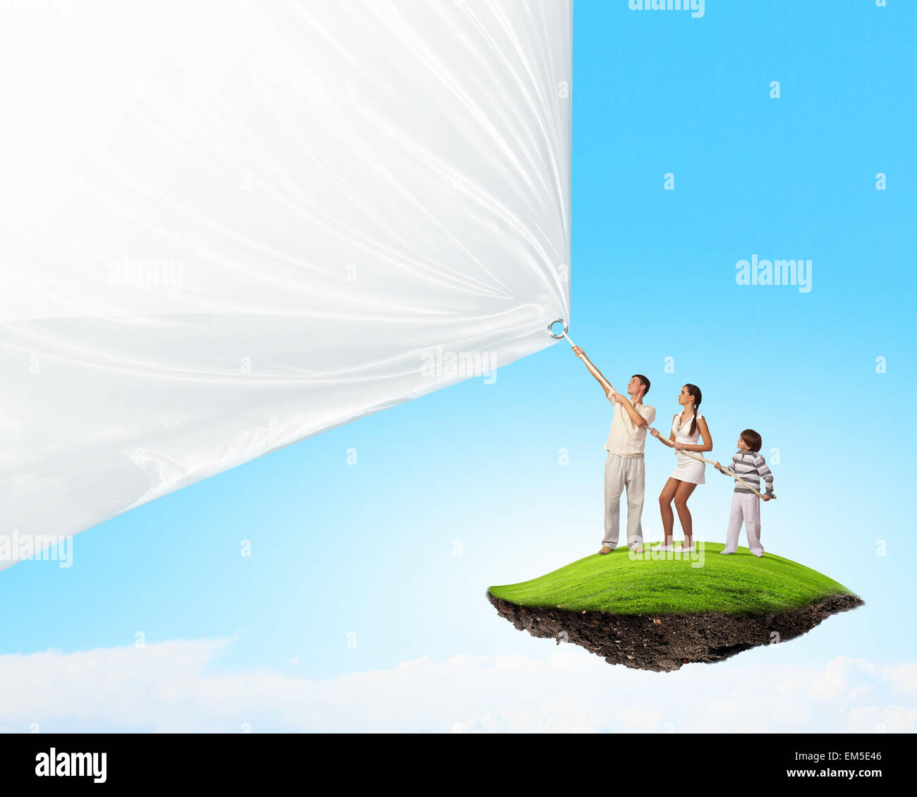 Young family pulling banner Stock Photo - Alamy