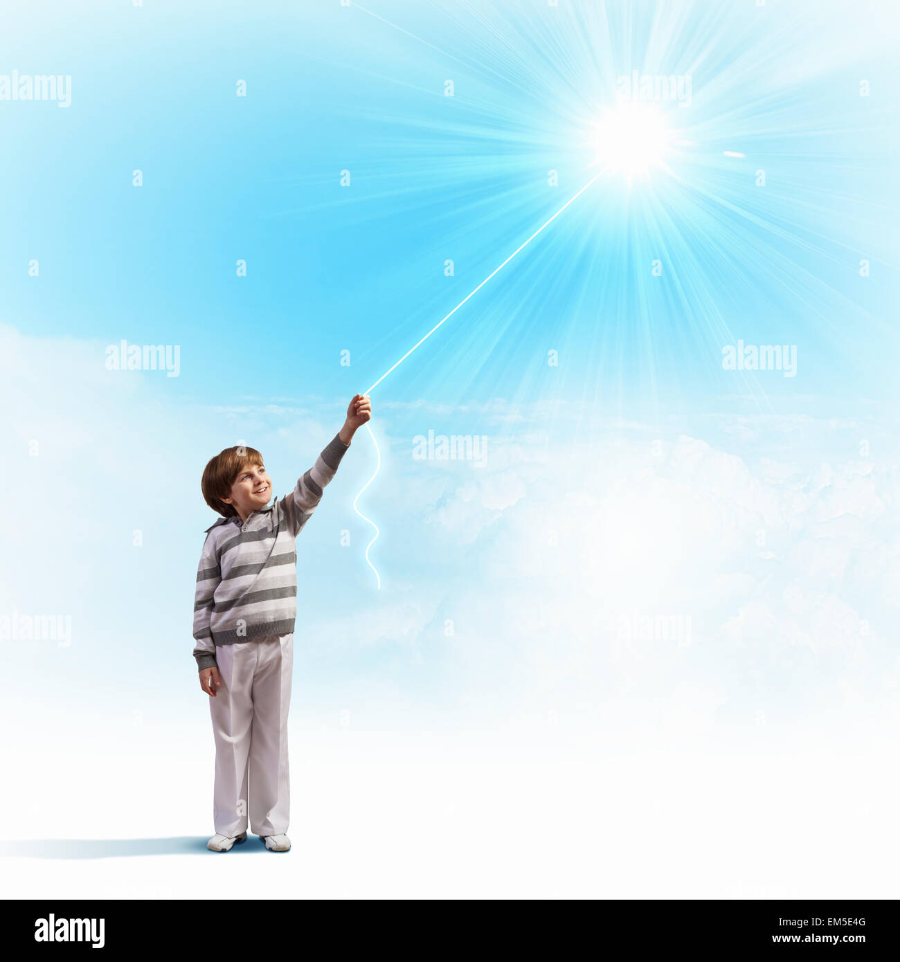 Cute boy catching sun Stock Photo - Alamy