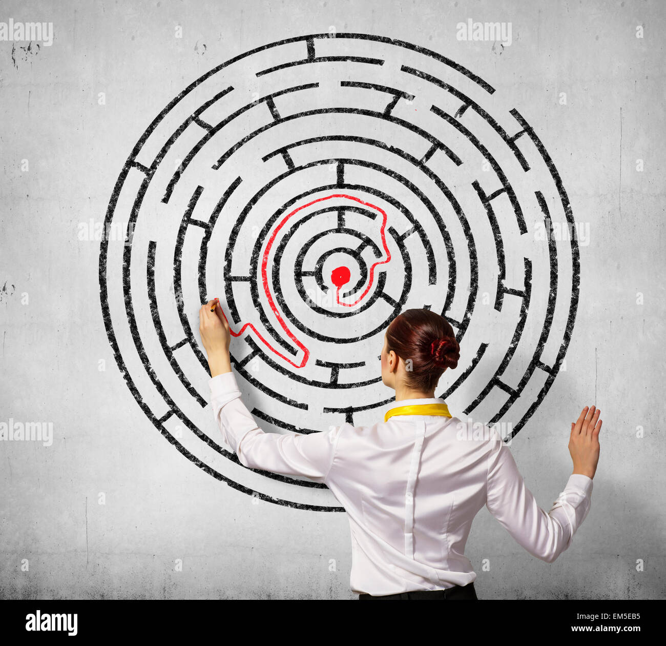 Businesswoman solving maze problem Stock Photo - Alamy