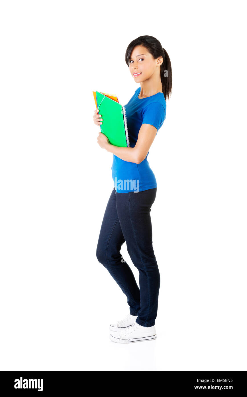 Happy student woman with notebooks Stock Photo - Alamy