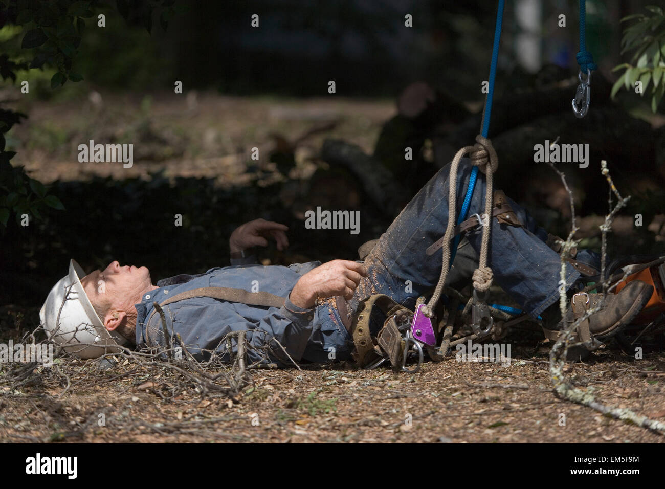 A man laying on the ground Stock Photo - Alamy