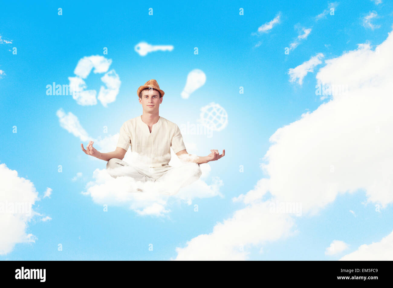 Young handsome man meditating sitting on clouds hi-res stock ...