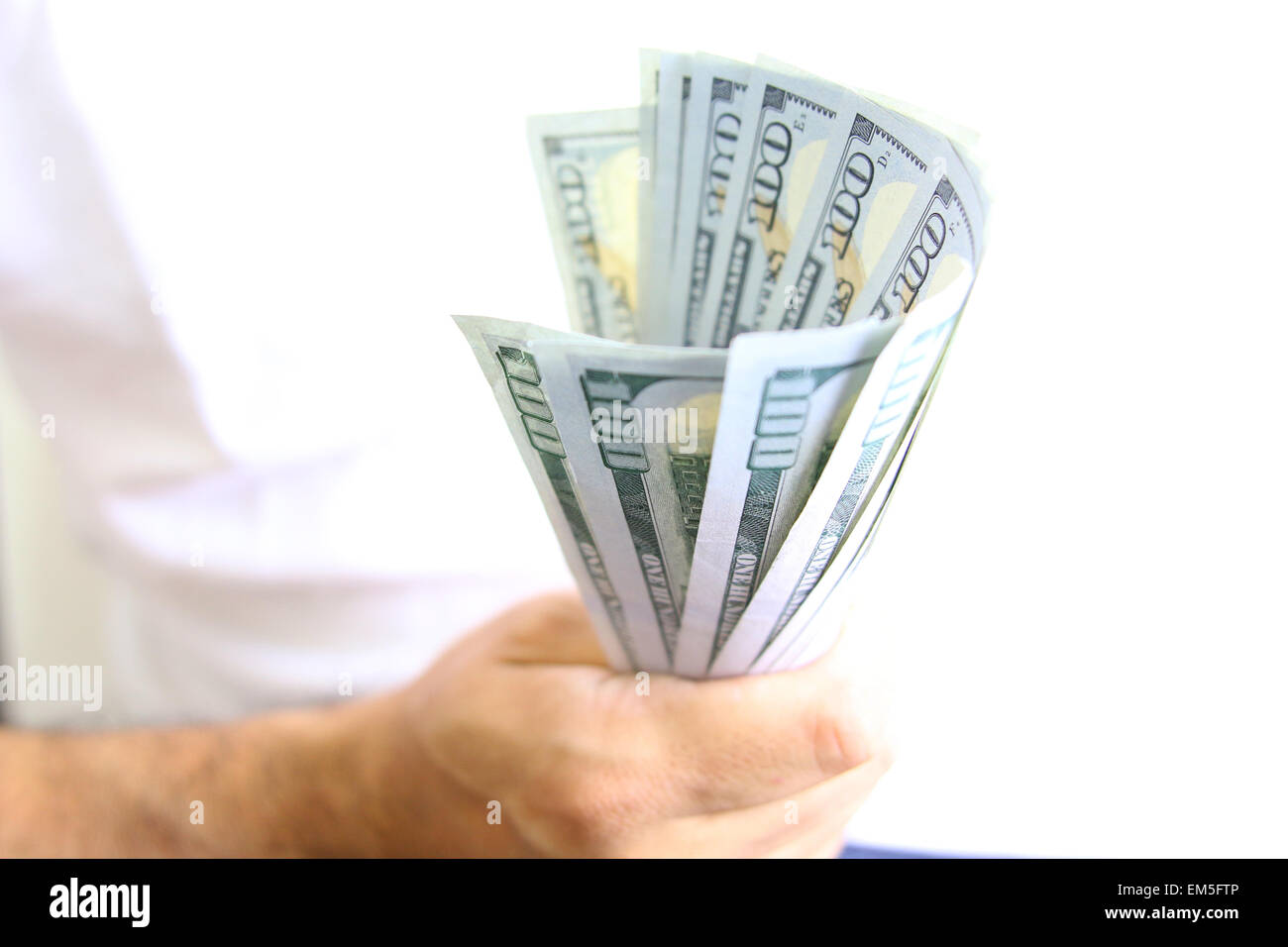 Young man holding cash notes hi-res stock photography and images - Alamy