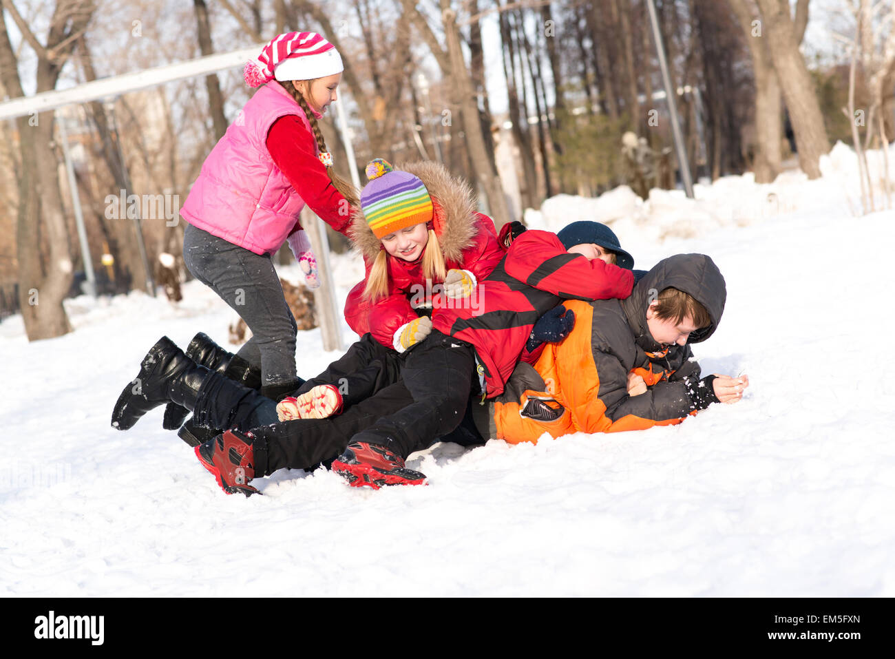 Children in Winter Park fooled in the snow Stock Photo - Alamy