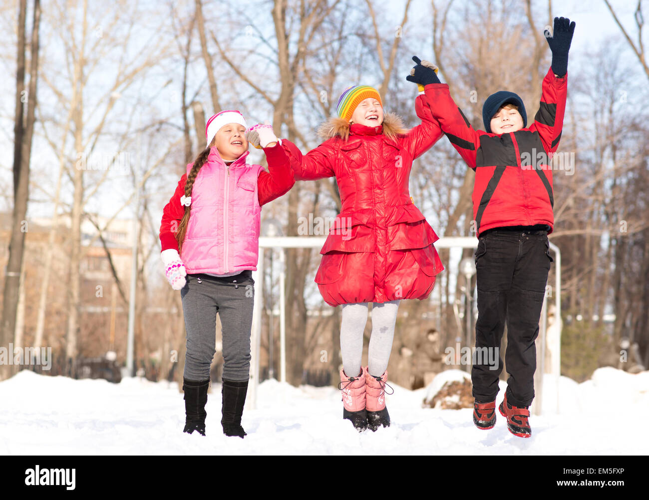 Children in Winter Park fooled in the snow Stock Photo - Alamy