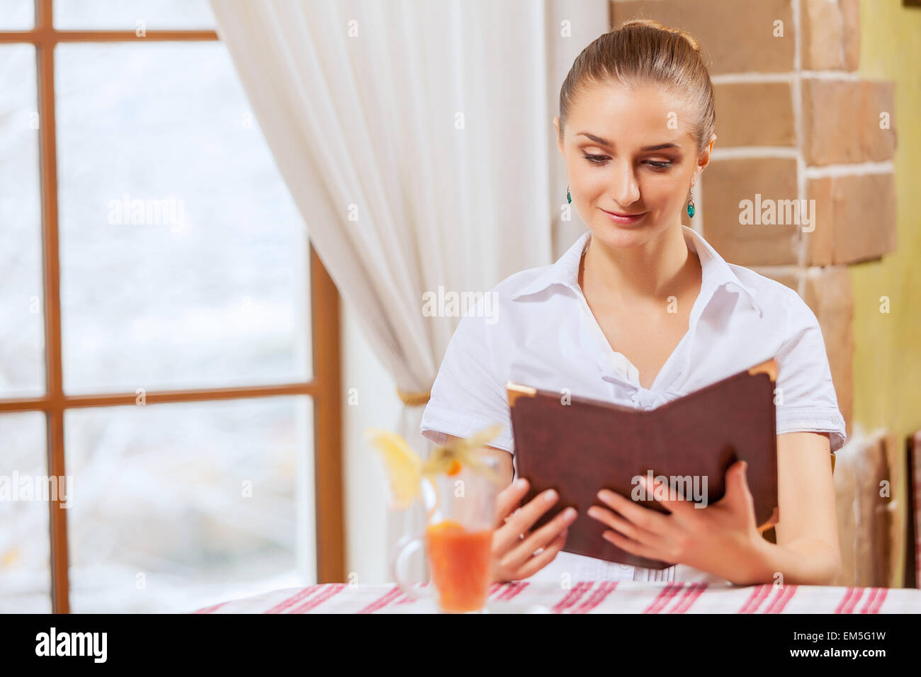 Pretty woman in restaurant Stock Photo - Alamy