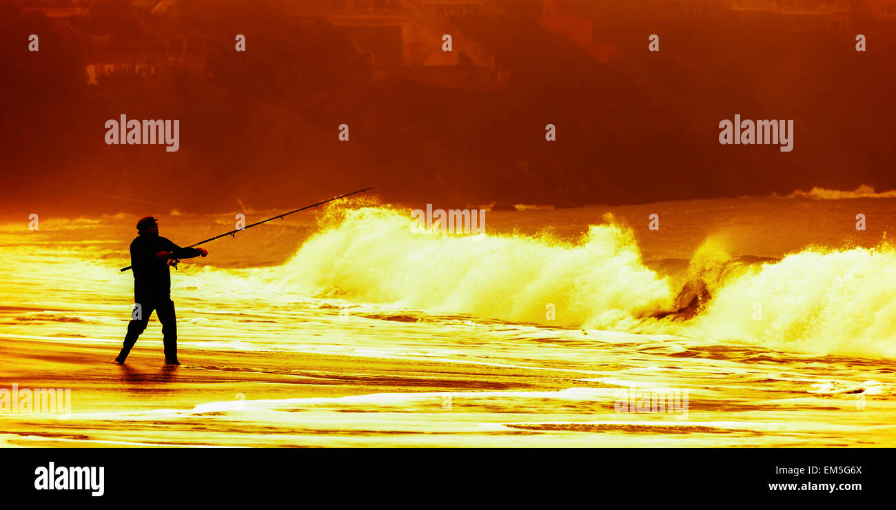 Fishing at the beach Stock Photo - Alamy