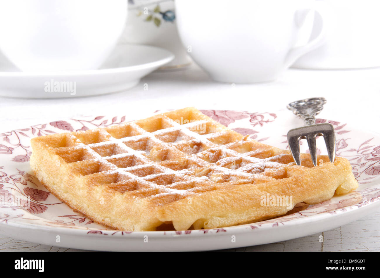 Waffle with powdered sugar Stock Photo - Alamy