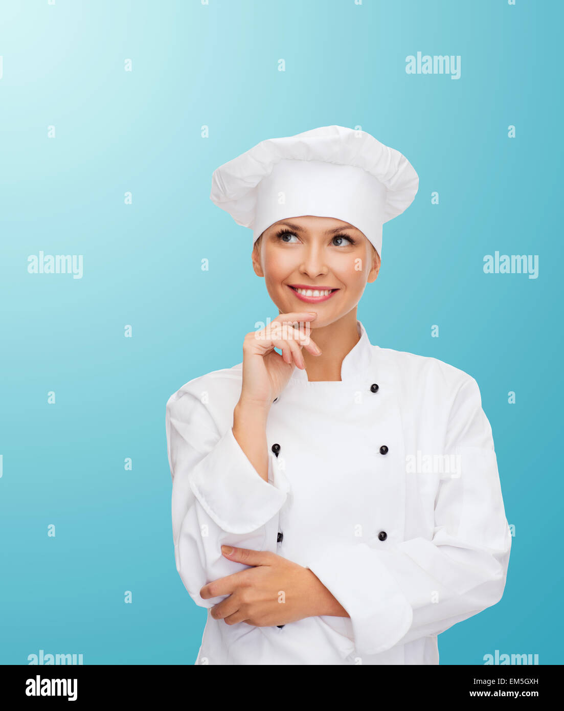 smiling female chef dreaming Stock Photo - Alamy