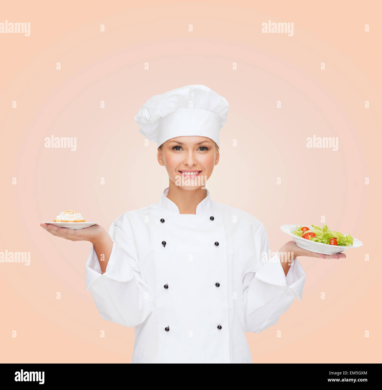 smiling female chef with salad and cake on plates Stock Photo - Alamy