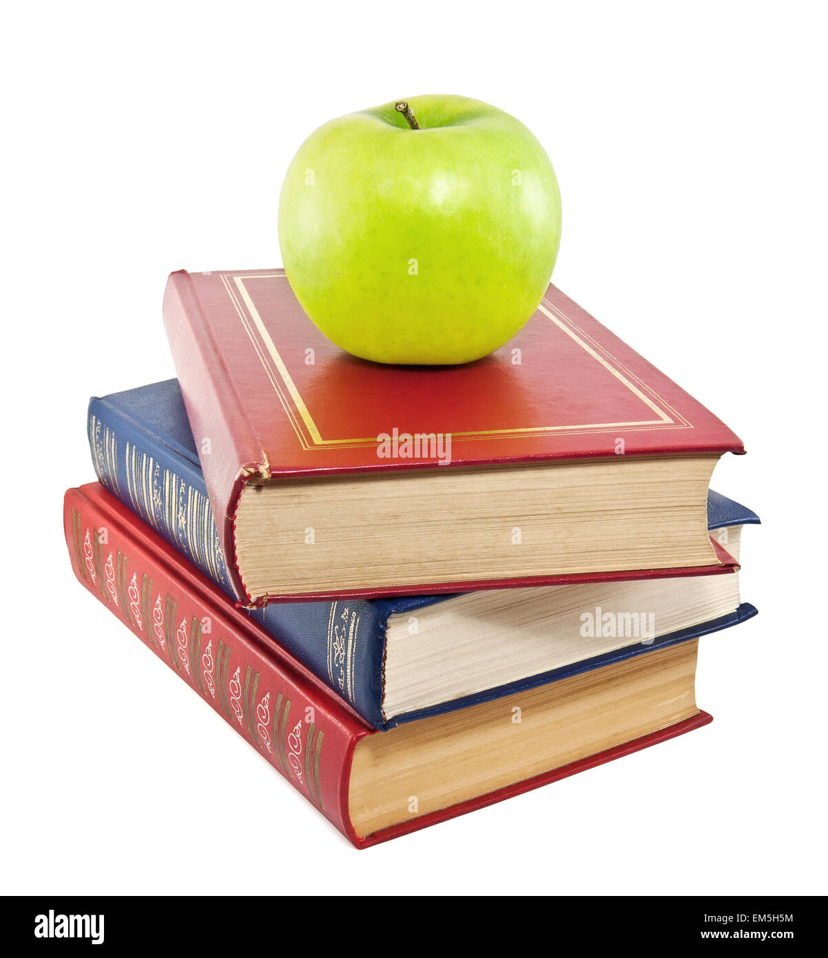 Apple on top of stack of old books Stock Photo - Alamy
