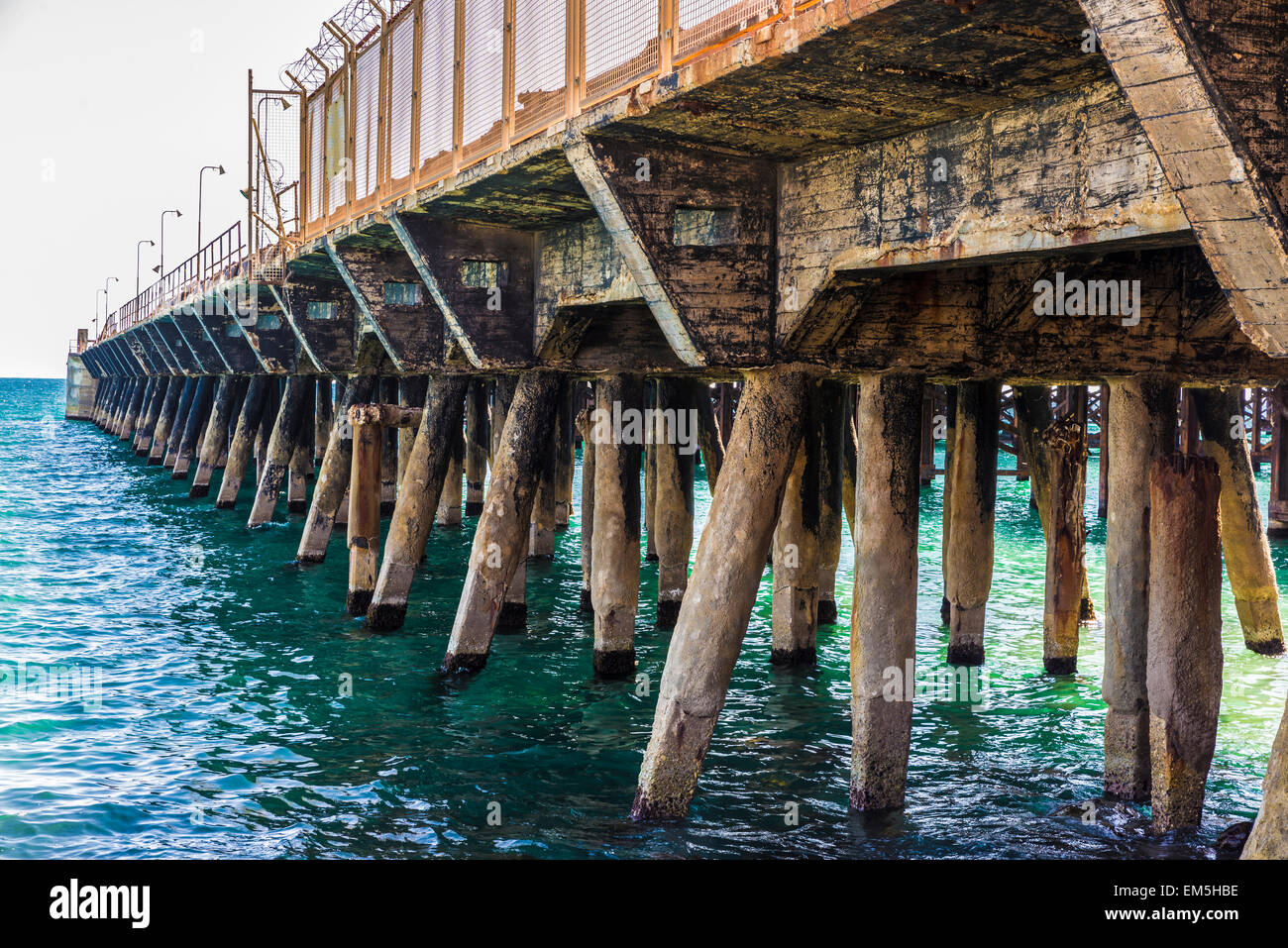 Industrial jetty protected with barbed wire to prevent passage in ...