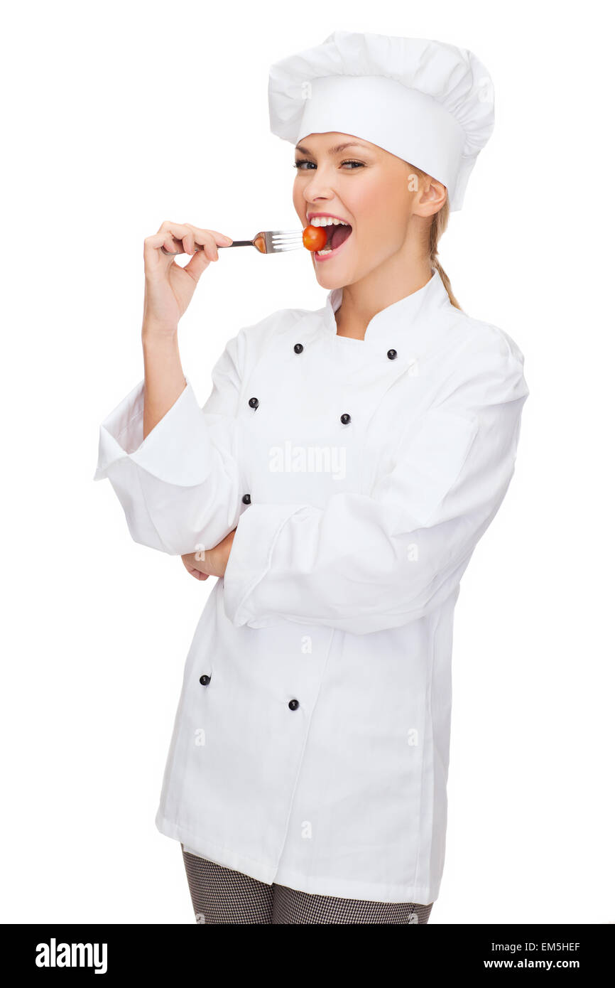 female chef, cook or baker with fork and tomato Stock Photo - Alamy