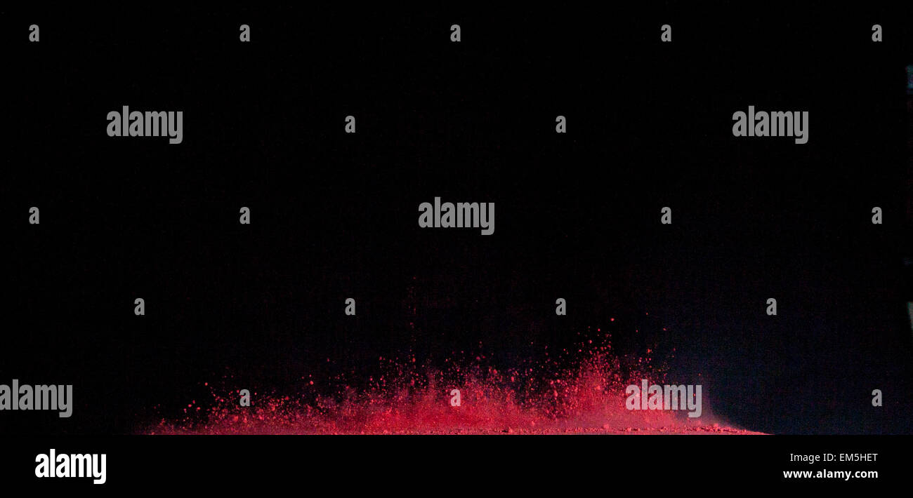 red powder paint explosion Stock Photo - Alamy