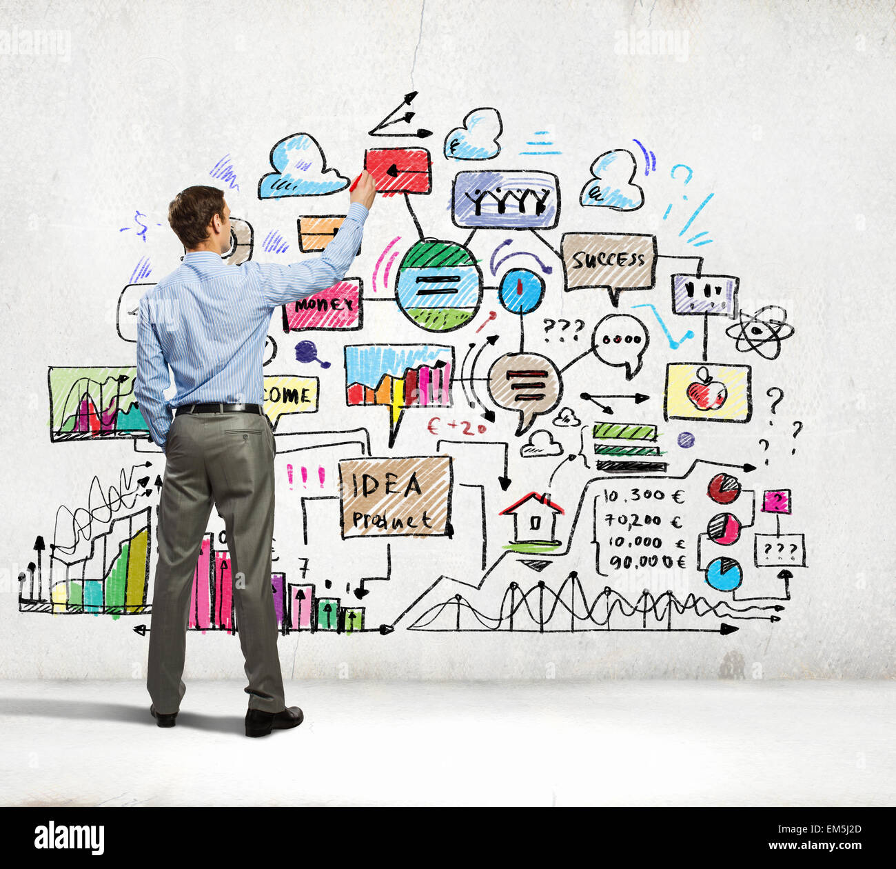 Businessman drawing sketches on wall Stock Photo - Alamy