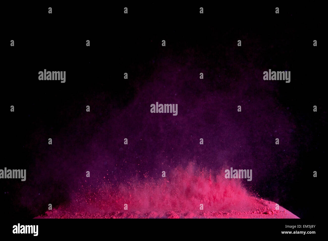 red powder paint explosion Stock Photo - Alamy