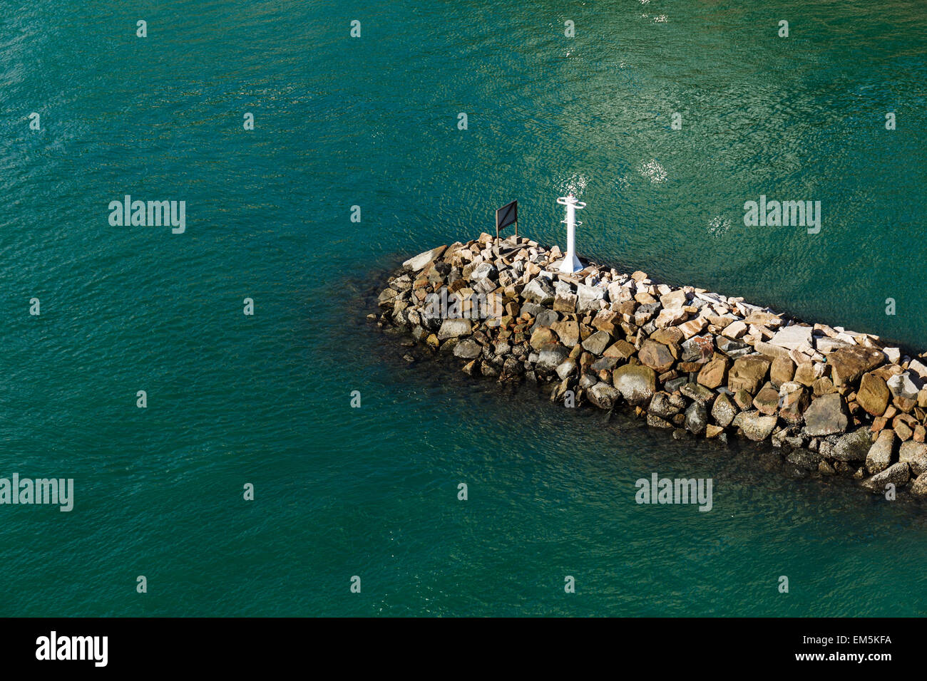 Wave breaker stone Stock Photo - Alamy