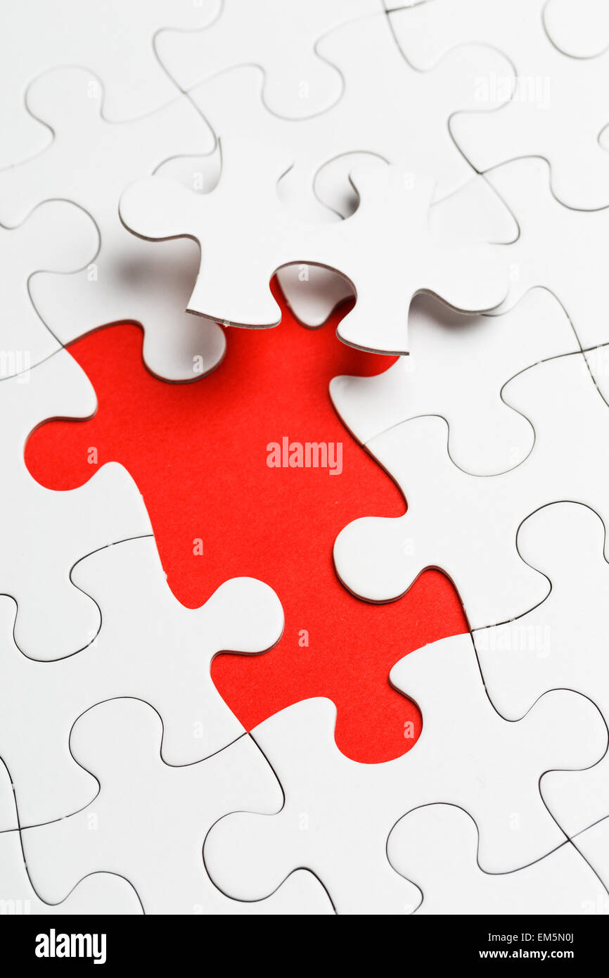 Incomplete puzzle with missing piece Stock Photo - Alamy