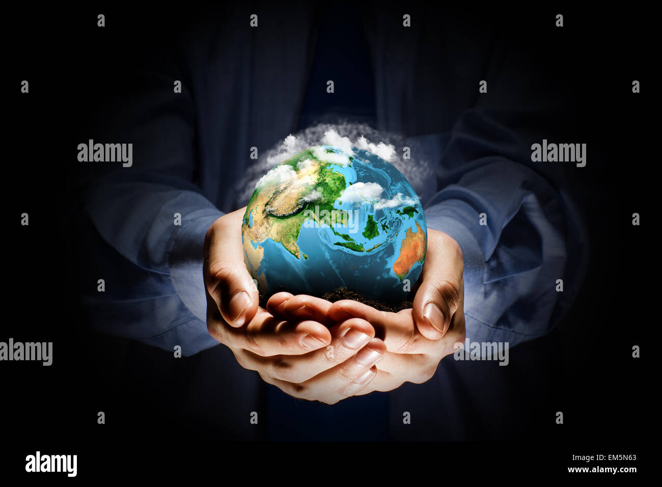Earth planet in hands Stock Photo - Alamy