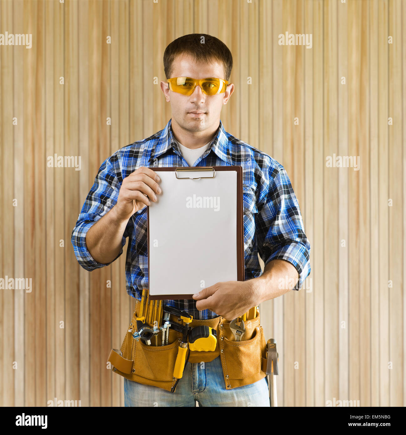 a worker holds clipboard Stock Photo - Alamy
