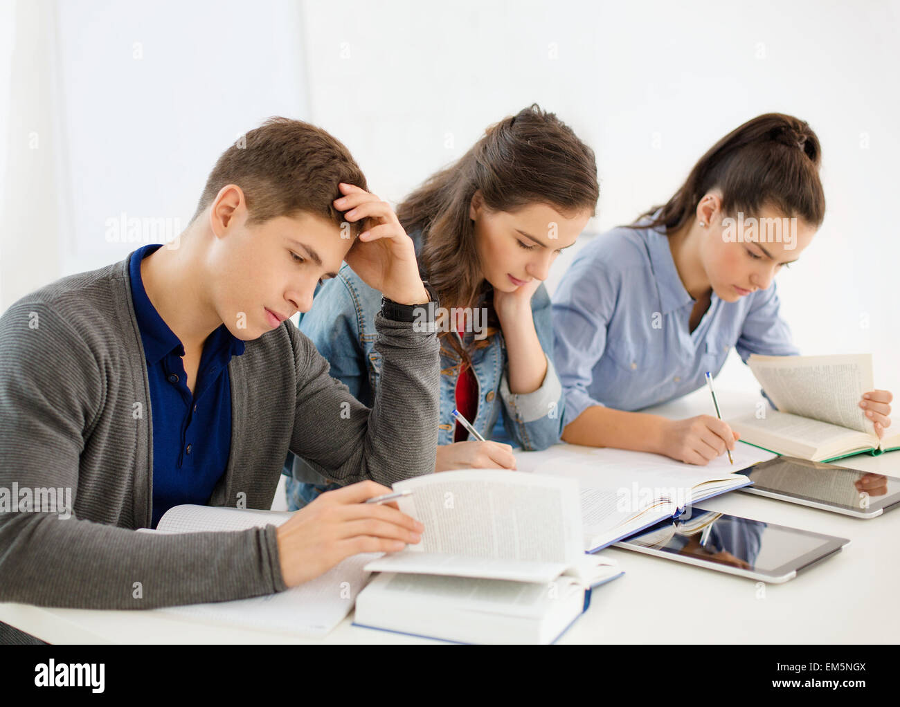students with notebooks and tablet pc at school Stock Photo - Alamy