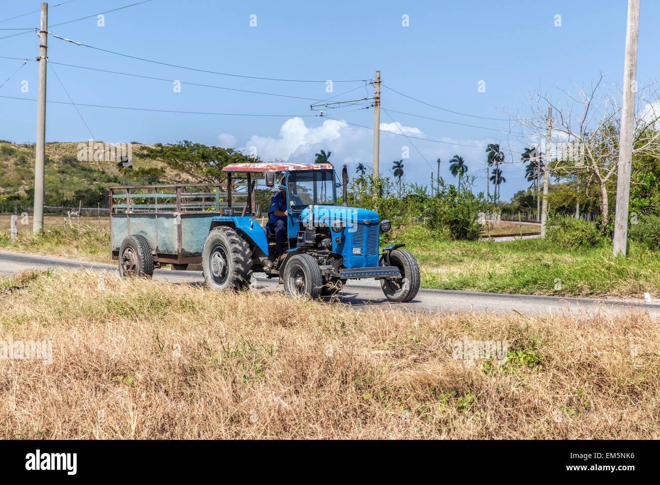 Tractor and trailer on a road in the country in a remote part of Cuba ...