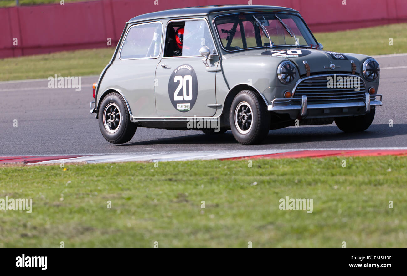 . A classic Mini, lifts its rear inside wheel, whilst taking a corner ...