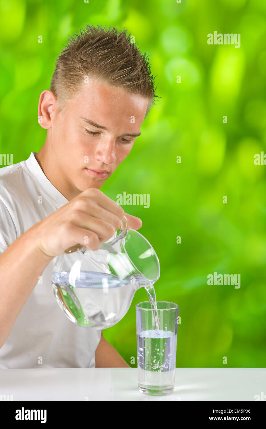 boy filling water Stock Photo - Alamy